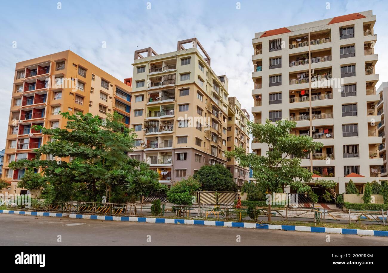 Commercial and residential apartment buildings with vehicles on city ...