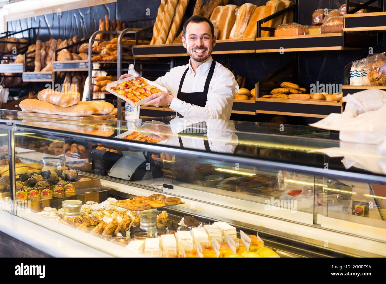 Monger shows a confection Stock Photo - Alamy