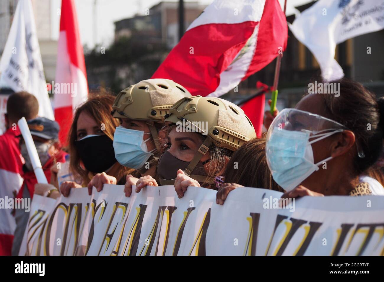 women wearing army helmets when hundreds, mainly women, carry out a ...