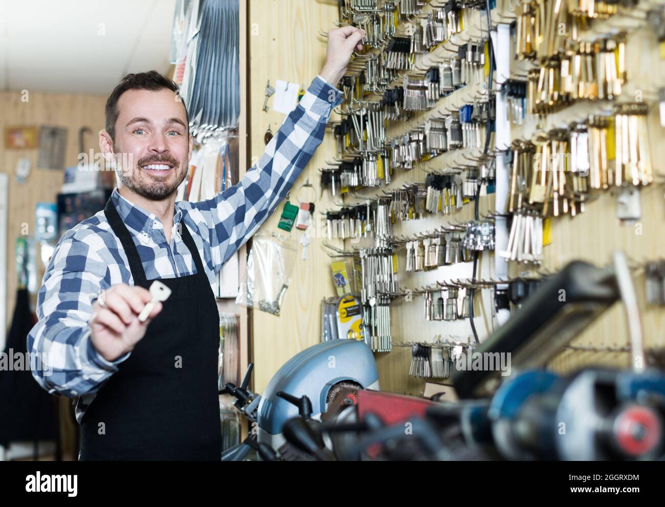 Worker displaying result of his key shaping Stock Photo - Alamy Worker displaying result of his key shaping Stock Photo - Alamy