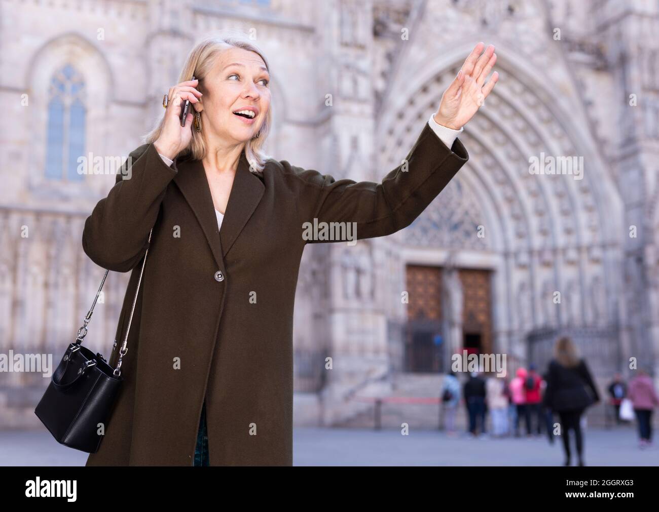 Waving to someone on the street hi-res stock photography and images - Alamy