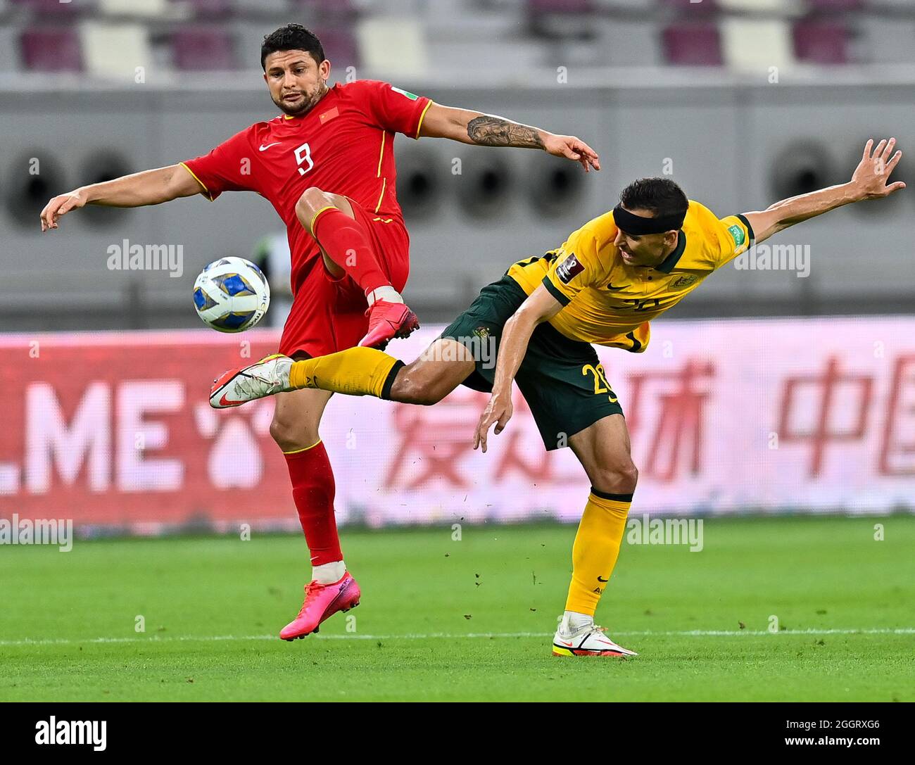 Doha, Qatar. 2nd Sep, 2021. Australia's Trent Sainsbury (R) vies with ...