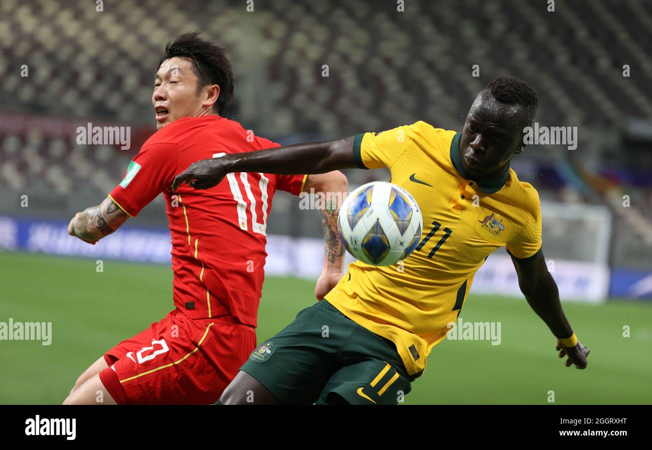 Doha, Qatar. 2nd Sep, 2021. Australia's Awer Mabil (R) and China's ...