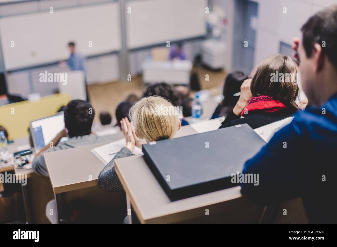 Professor giving presentation in lecture hall at university Stock Photo ...