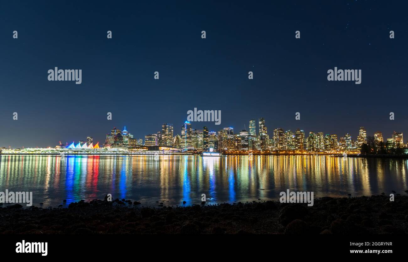 Vancouver downtown skyline night panorama. Colorful buildings lights ...