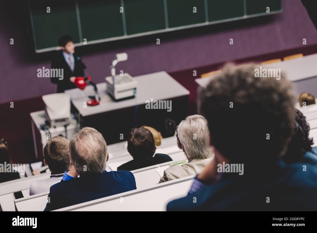Professor giving presentation in lecture hall at university Stock Photo ...