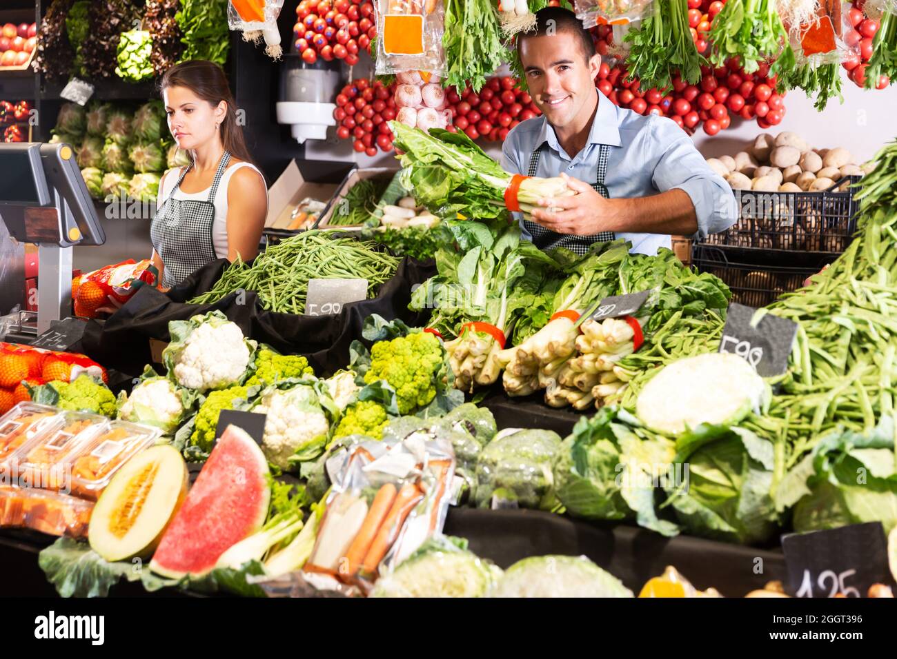 Man selling fruits and vegetables Stock Photo - Alamy