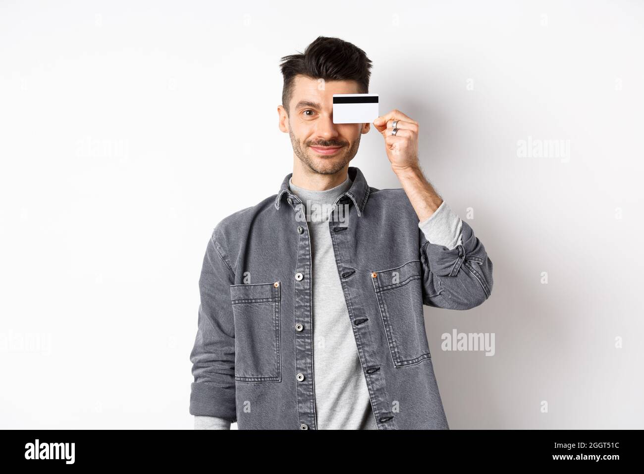 Handsome modern guy with moustache, standing in casual clothes and ...
