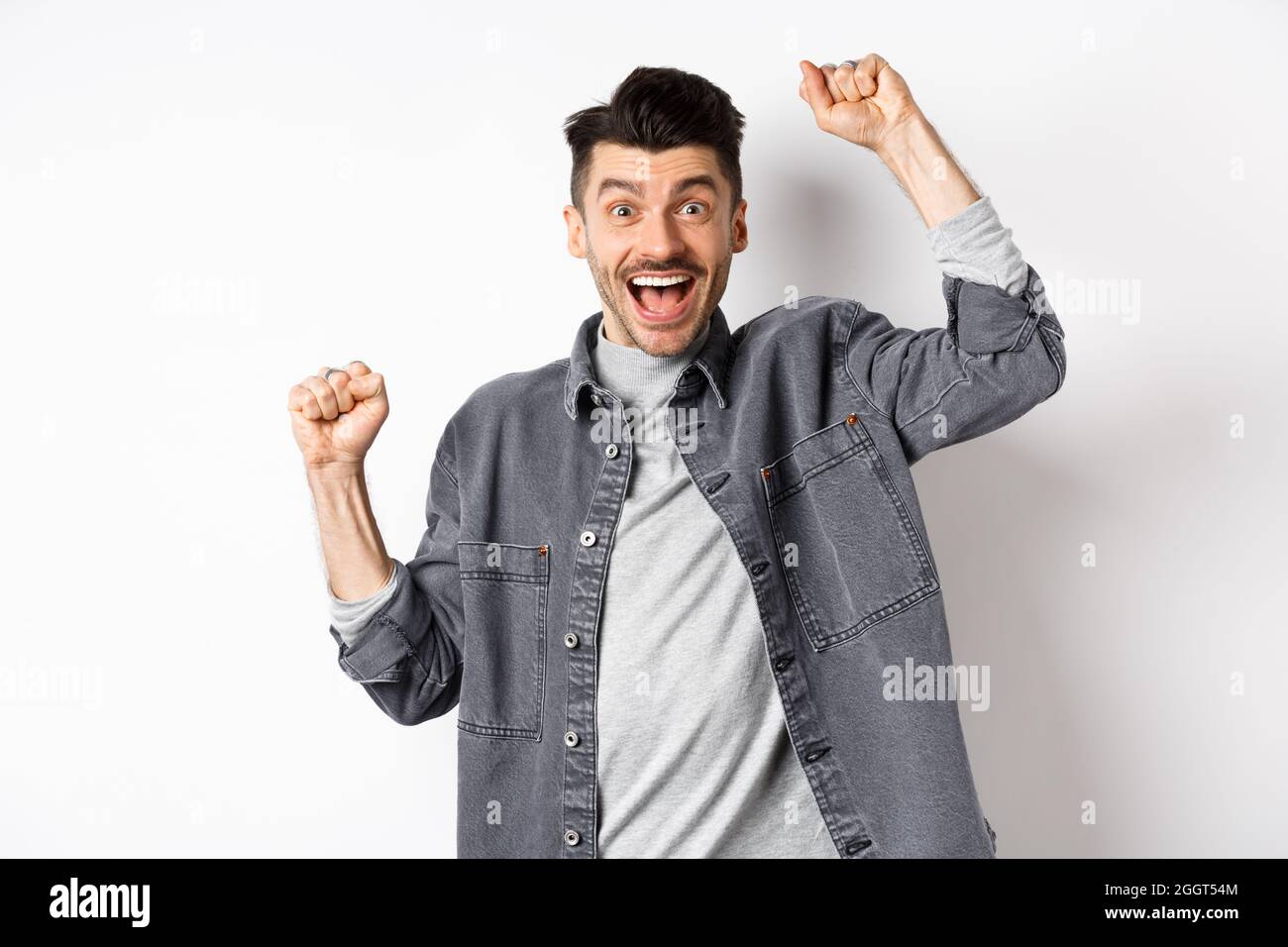 Excited man shouting from joy, winning prize and rejoicing, raising ...