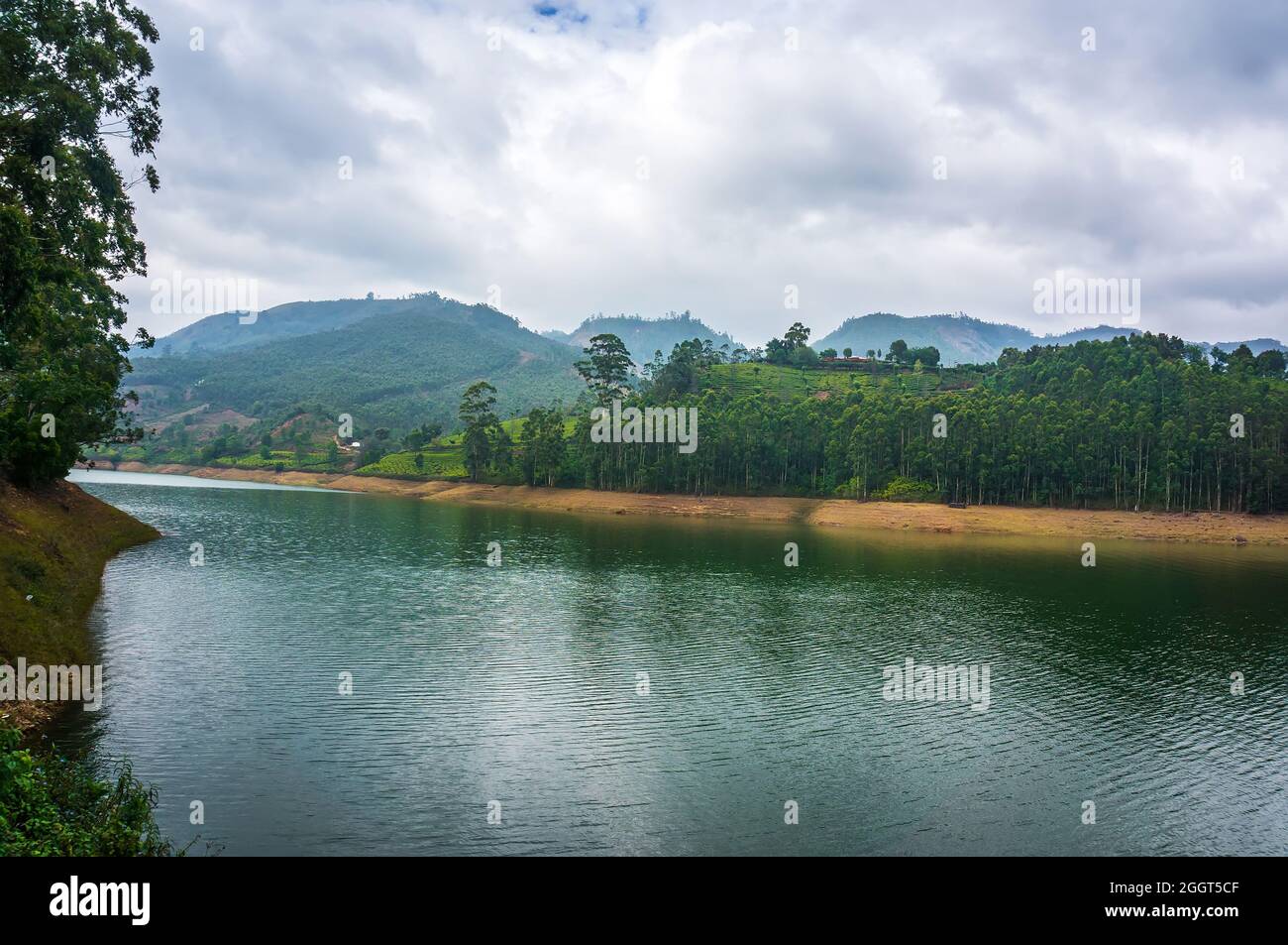 Beautiful landscape with mountain lake amid high mountains with tea ...