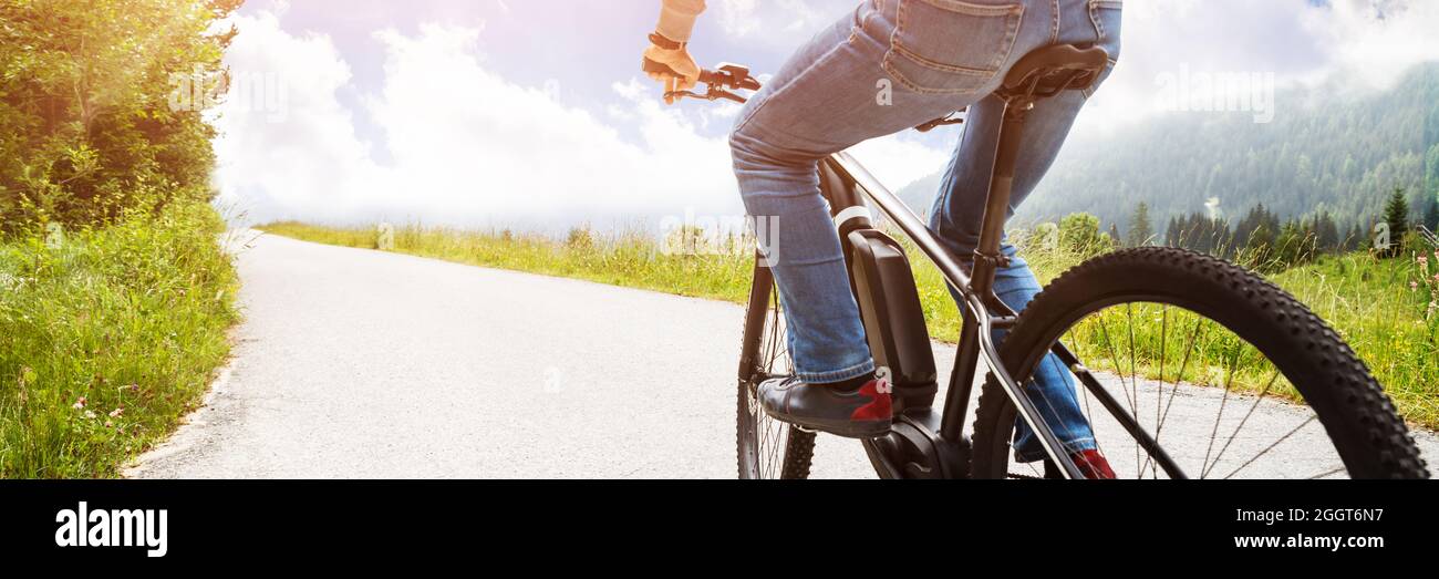 Man Riding Electric Mountain Bike In Alps Stock Photo - Alamy