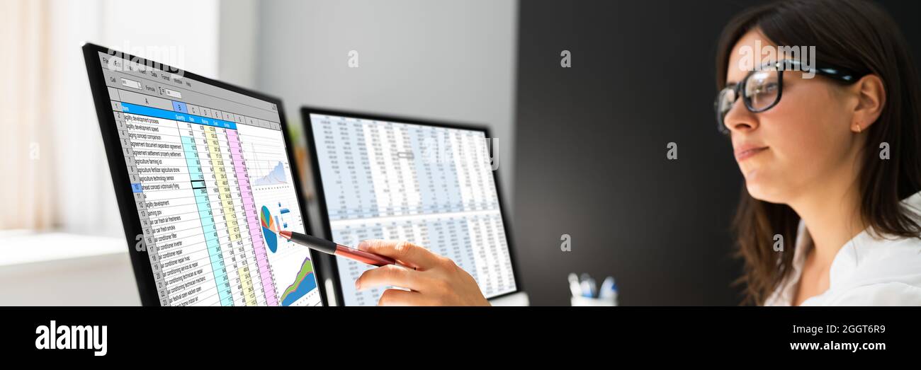 Analyst Employee Working With Spreadsheet On Computer Stock Photo - Alamy
