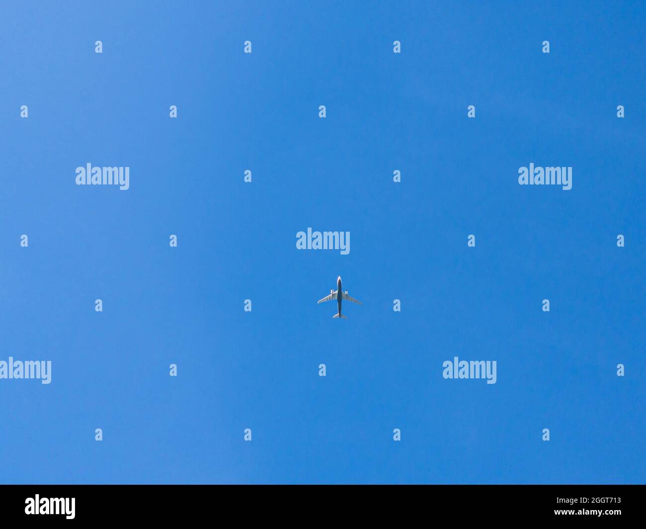 A commercial passenger aircraft across flying over head. Jet airplane ...