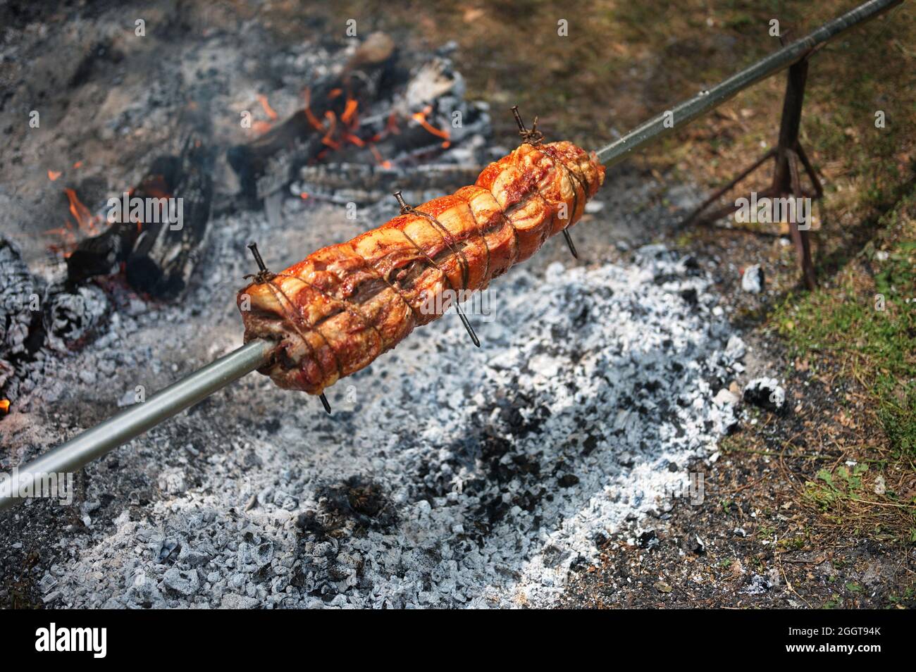 Pork meat baked on a spit Stock Photo - Alamy
