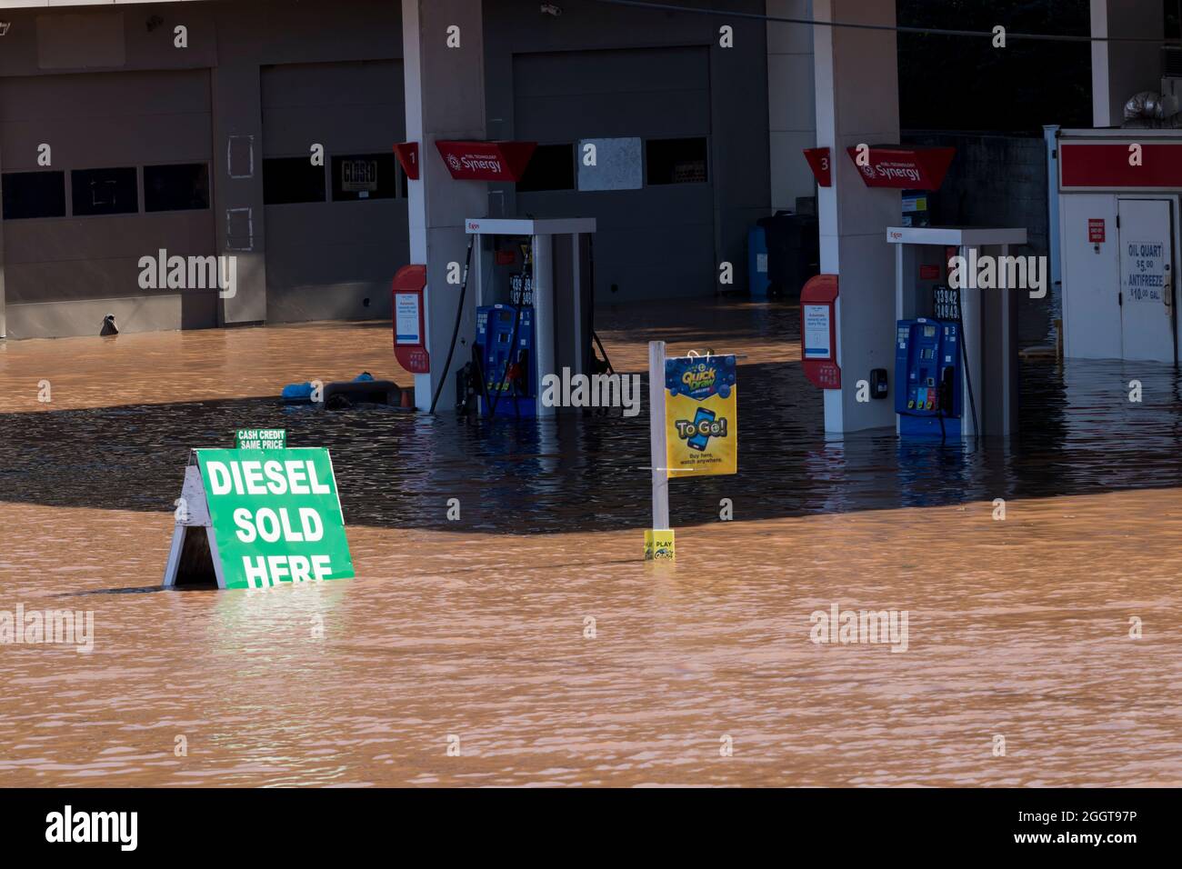 Gas pumps at gas station submerged under flood water in the aftermath ...