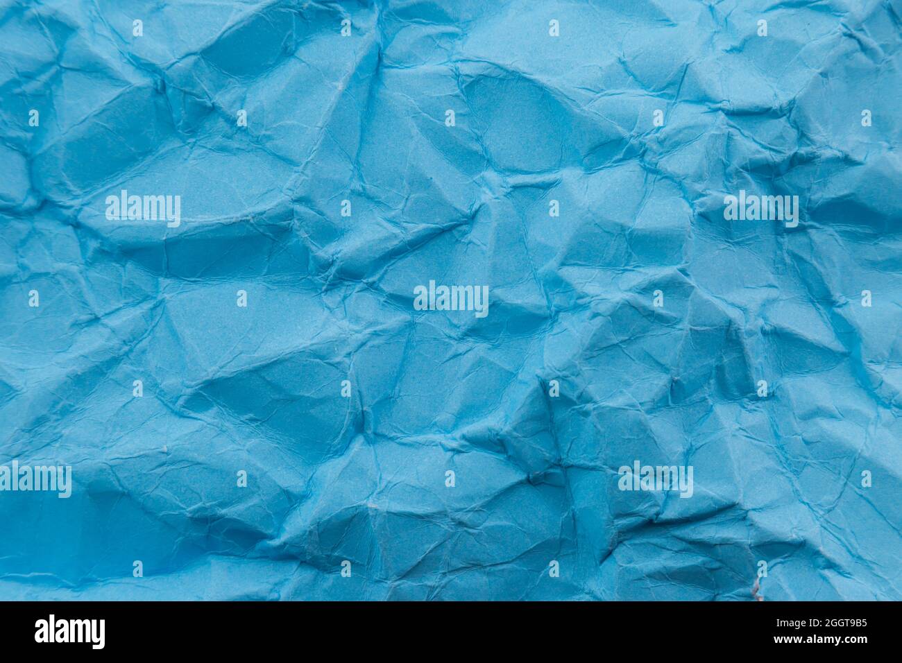 Blue crumpled paper use for background Stock Photo - Alamy