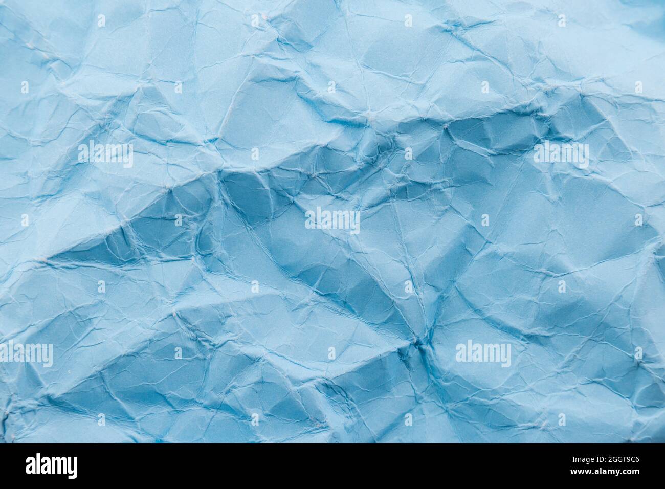 Blue crumpled paper use for background Stock Photo - Alamy