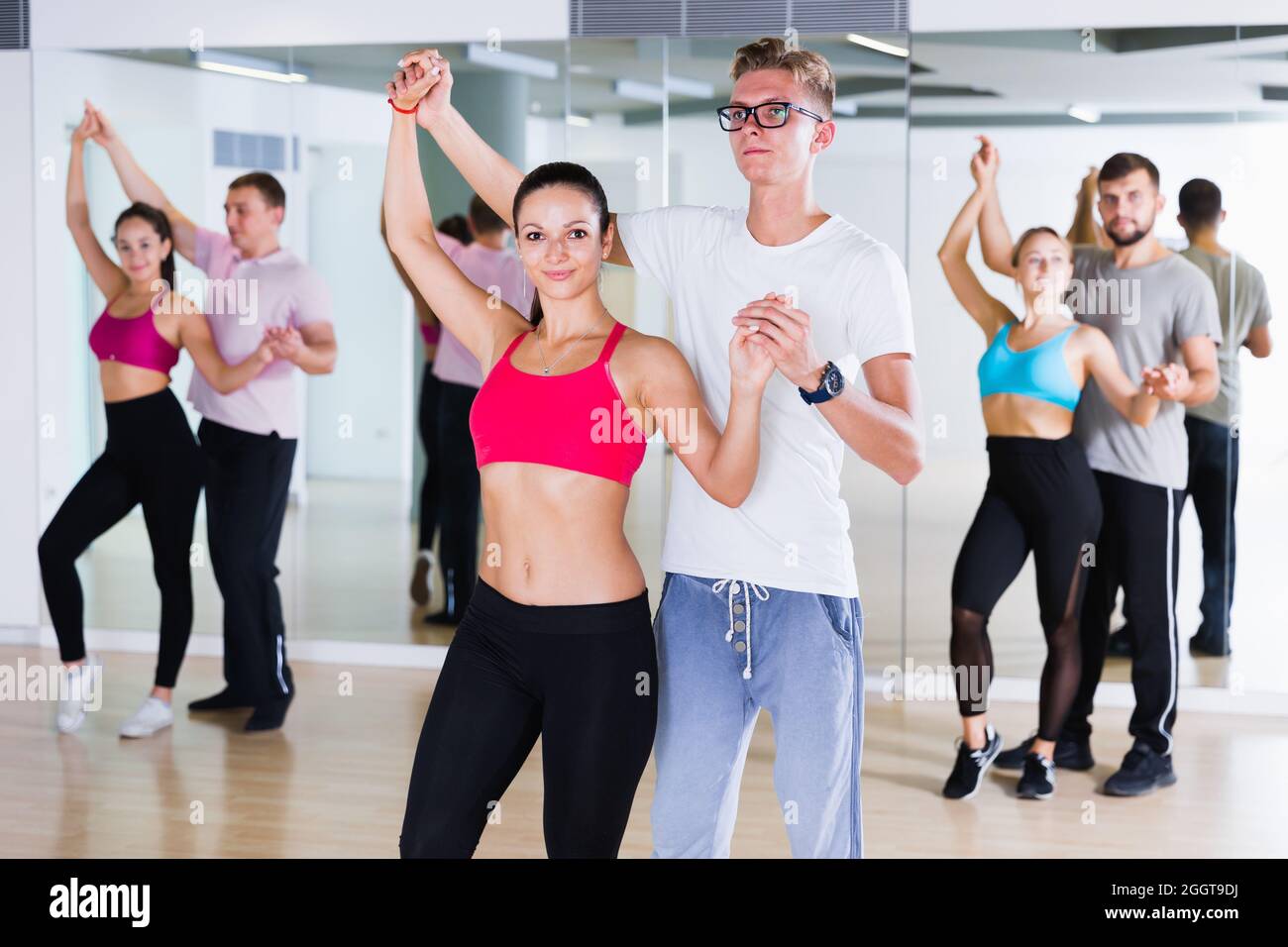 Positive dancing pair dance tango together Stock Photo - Alamy