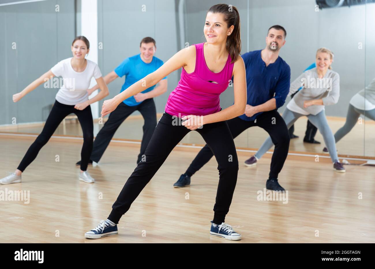 Woman training at group dance class Stock Photo - Alamy
