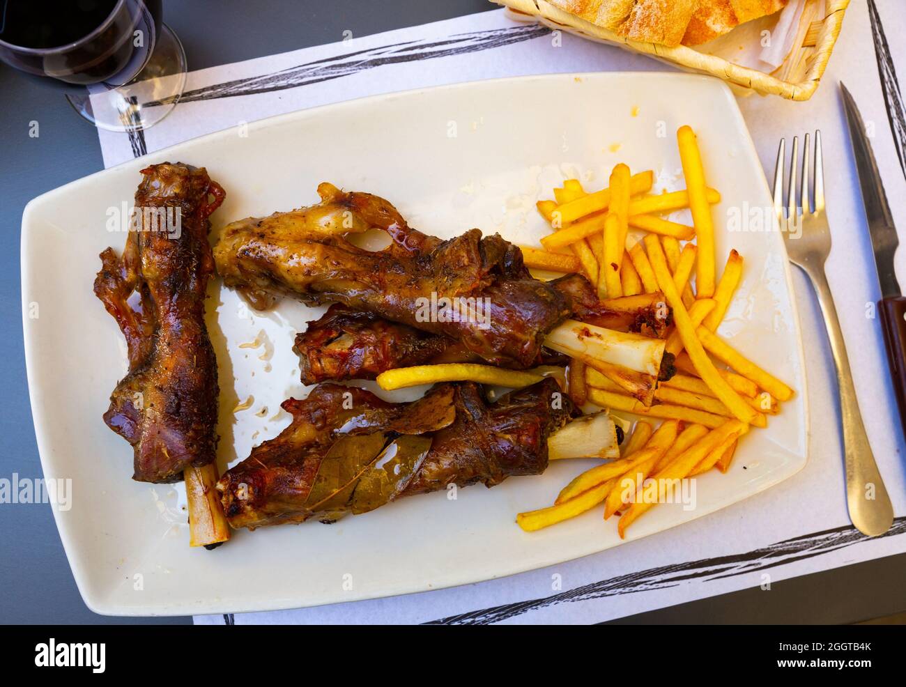 Baked lamb shins Stock Photo - Alamy
