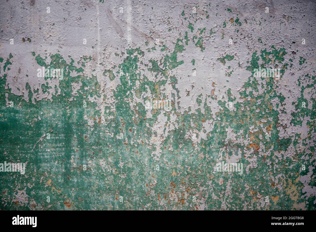 Old green metal surface with cracked paint texture close up background ...
