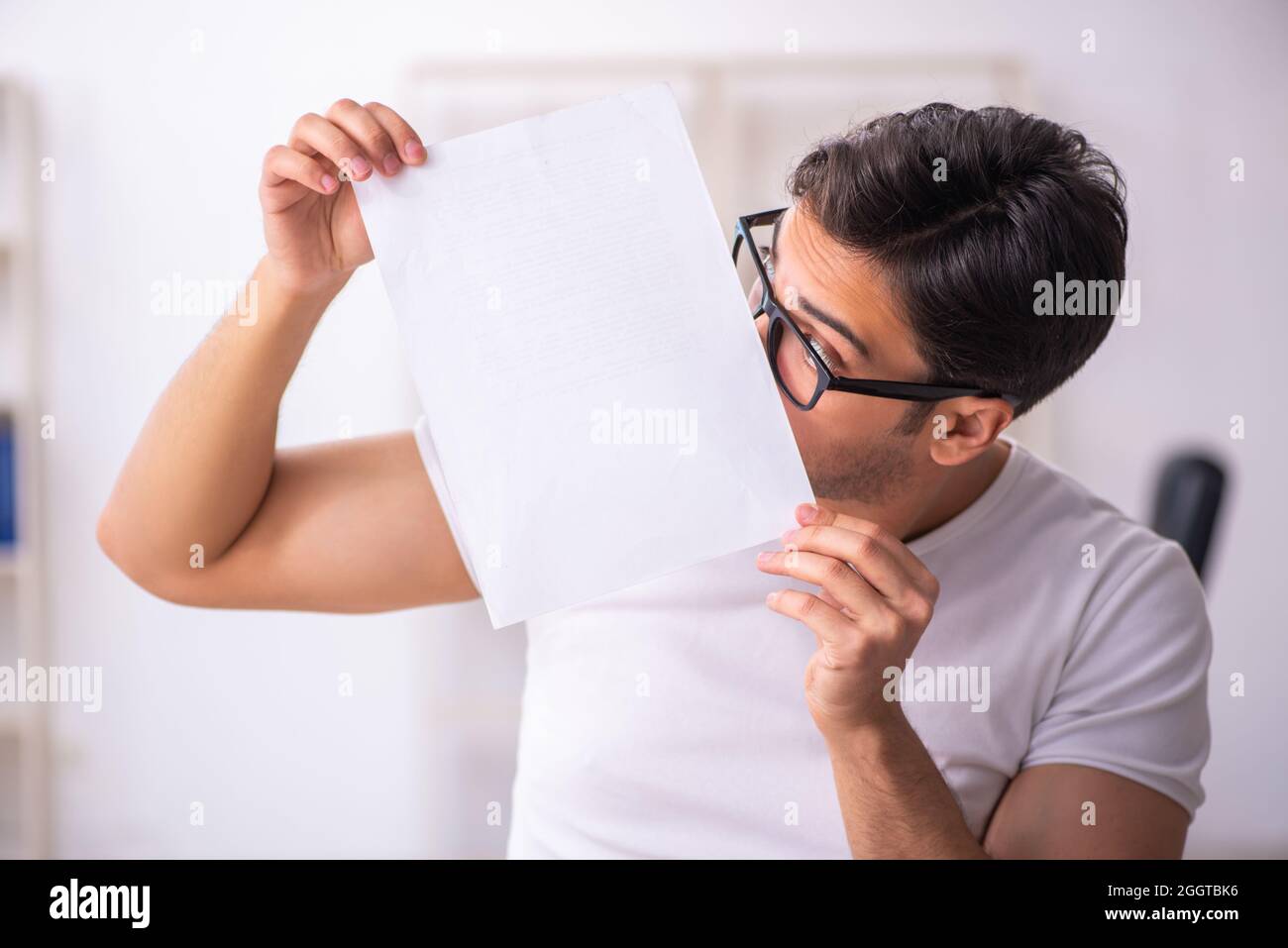Young student employee at workplace Stock Photo - Alamy