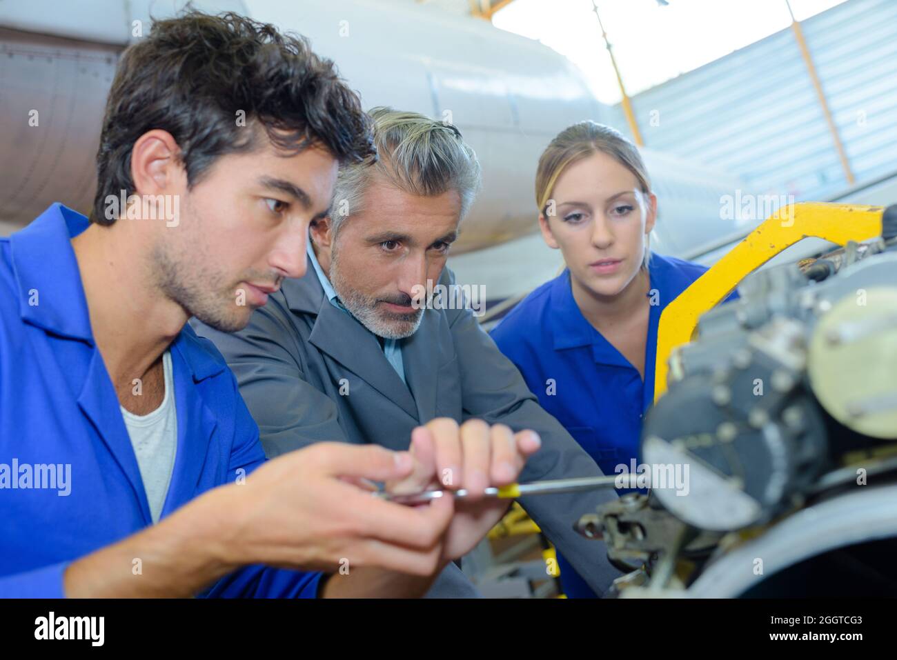 an aircraft technicians with supervisor Stock Photo - Alamy