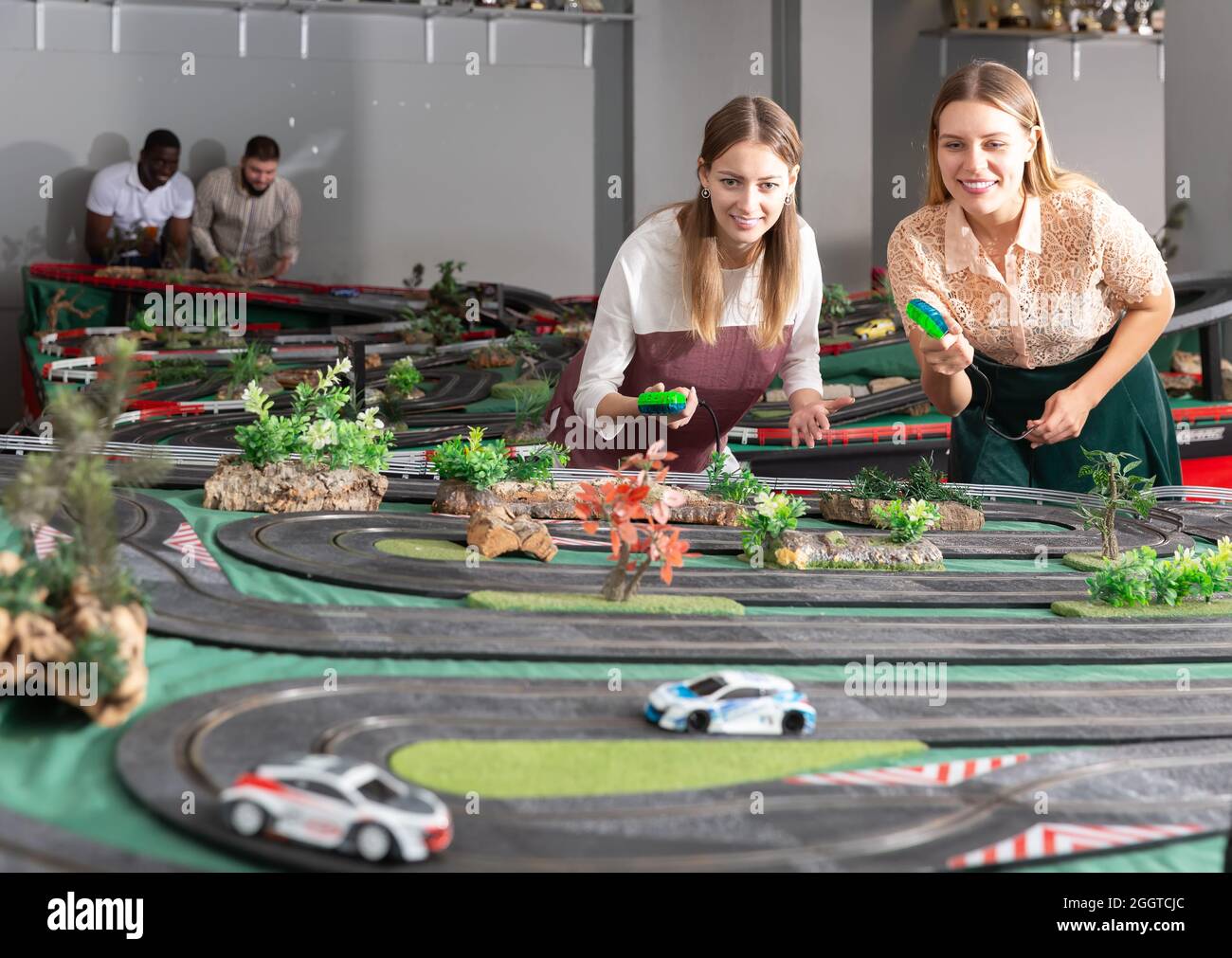 Two people with remote control cars hi-res stock photography and images ...
