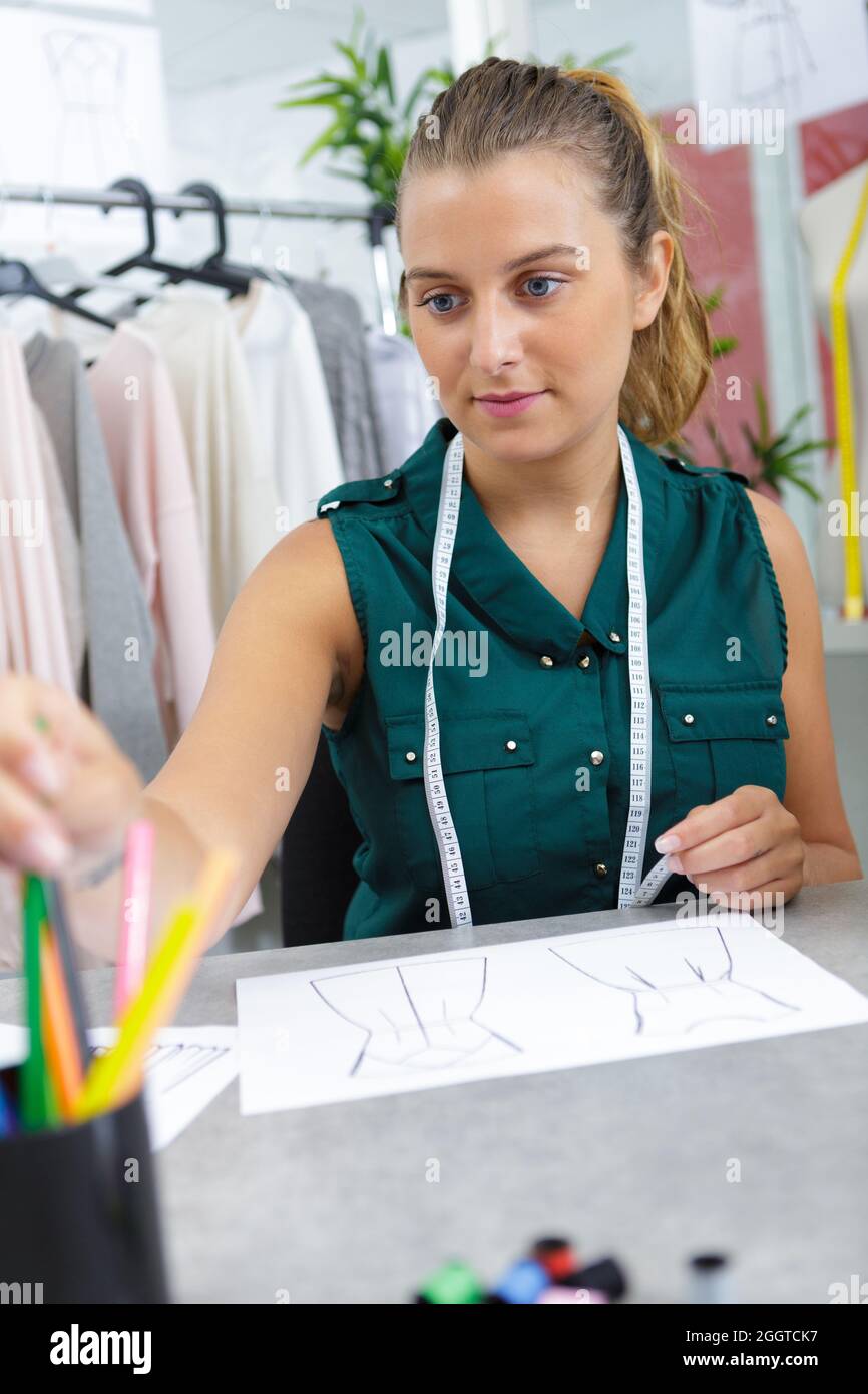 professional woman tailor designer drawing Stock Photo - Alamy