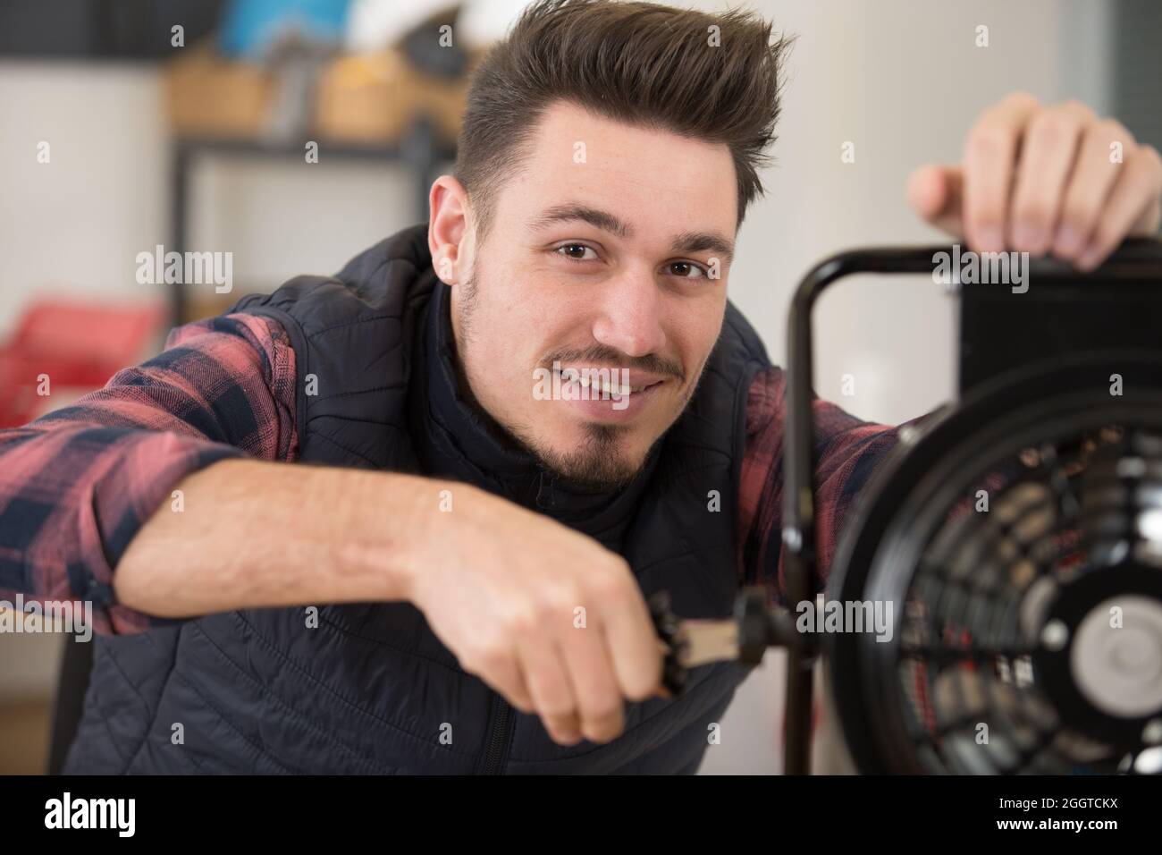 Fixing the fan hi-res stock photography and images - Alamy