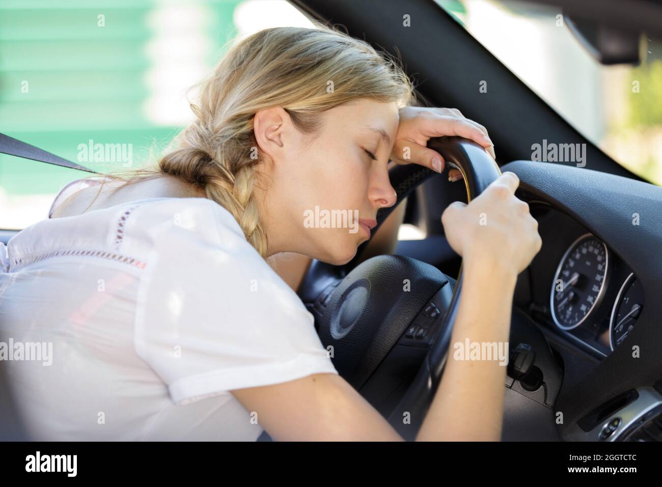 stressed woman driver sitting inside her car Stock Photo - Alamy