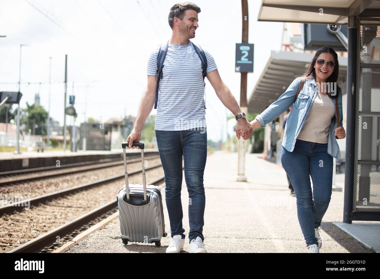 Couple embrace train station in hi-res stock photography and images - Alamy