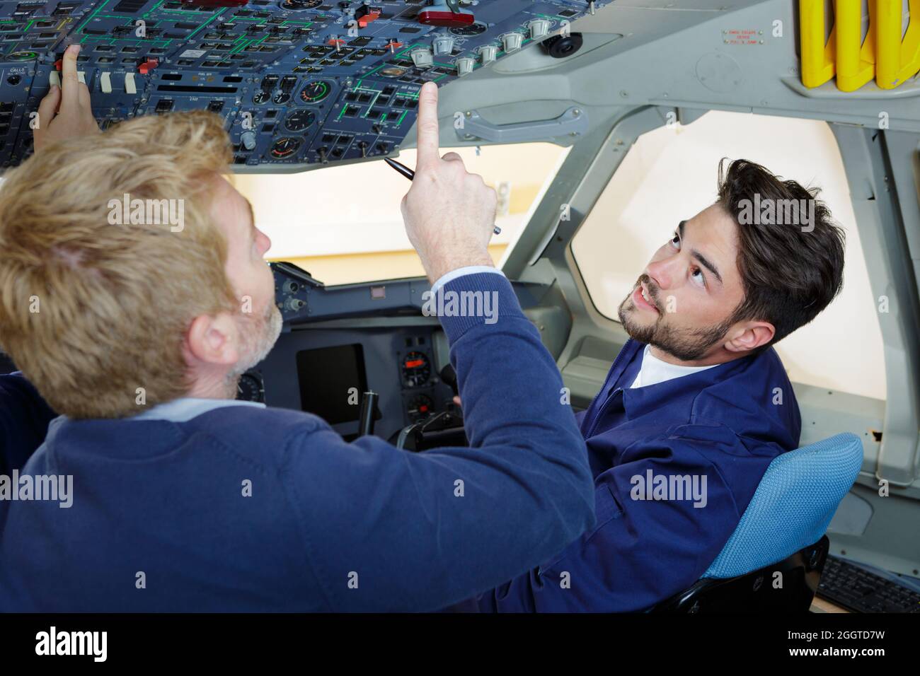 aircraft cockpit technician and apprentice Stock Photo - Alamy
