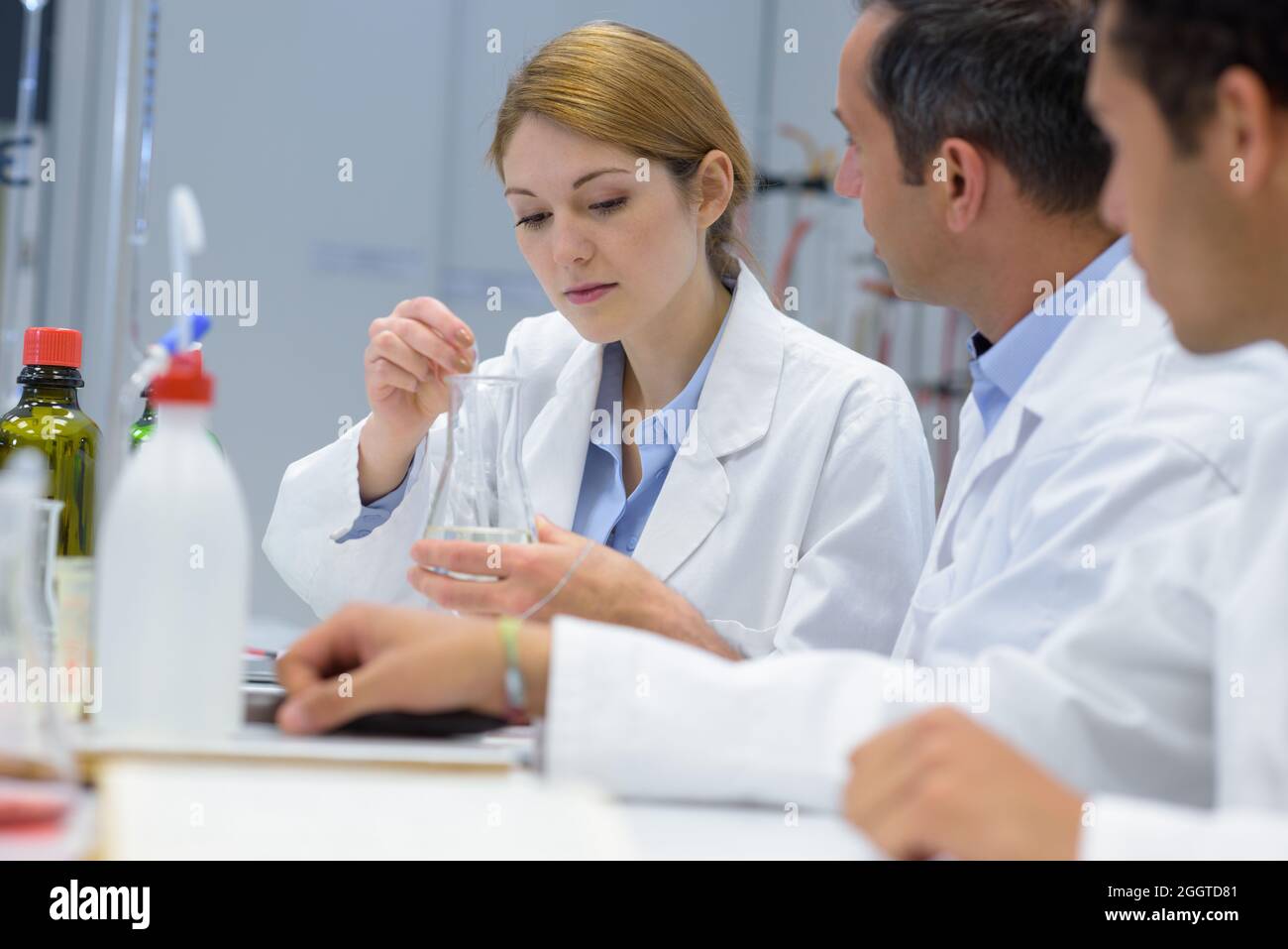 3 people in a lab Stock Photo - Alamy