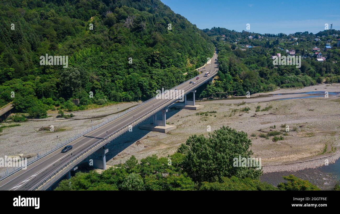 Directly above view - cars on rural bridge Stock Photo - Alamy