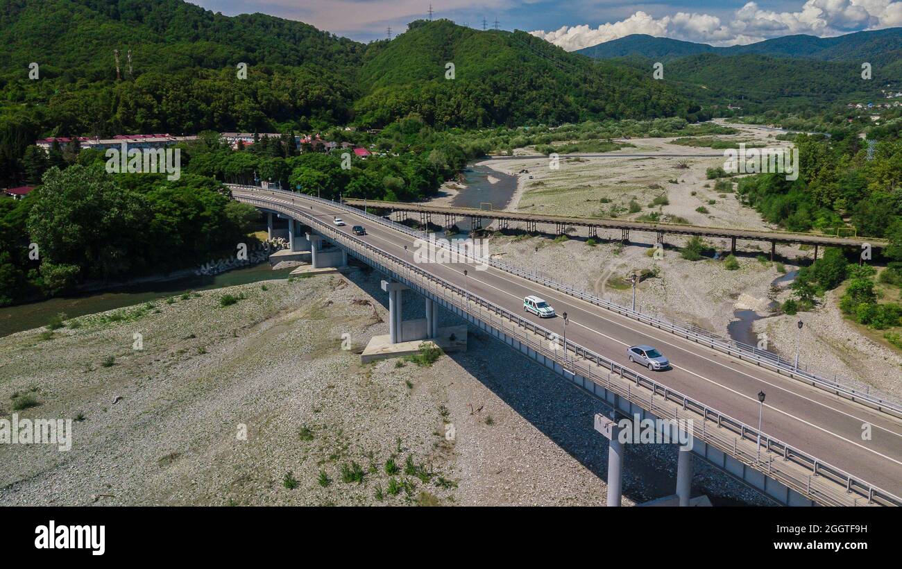 Directly above view - cars on rural bridge Stock Photo - Alamy