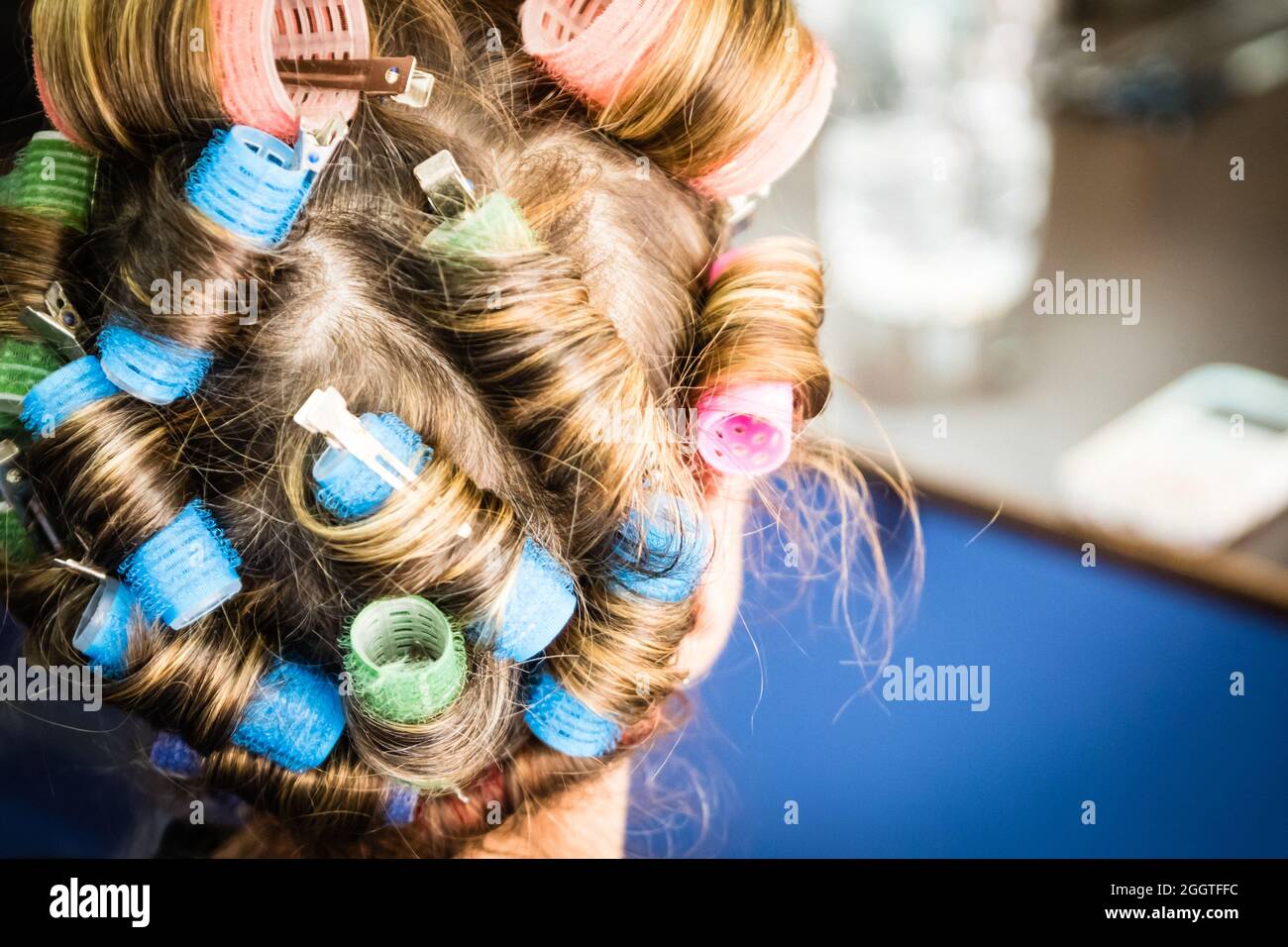 Blond girl hair curlers rollers hi-res stock photography and images - Alamy