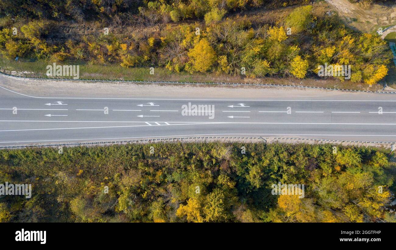 Highway through the forest. Top view from flying drone Stock Photo - Alamy