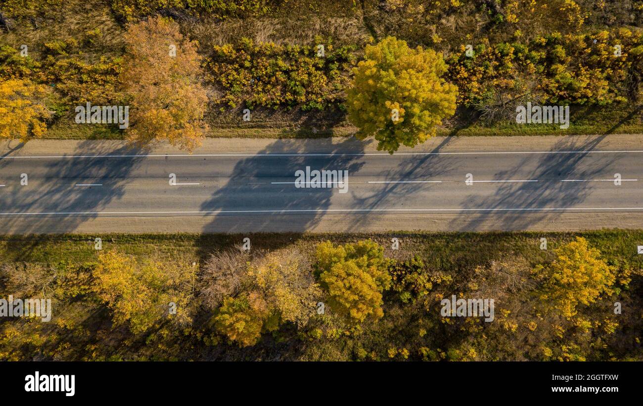 Overhead drone shot of freeway lane. with cars on the road, fly under ...