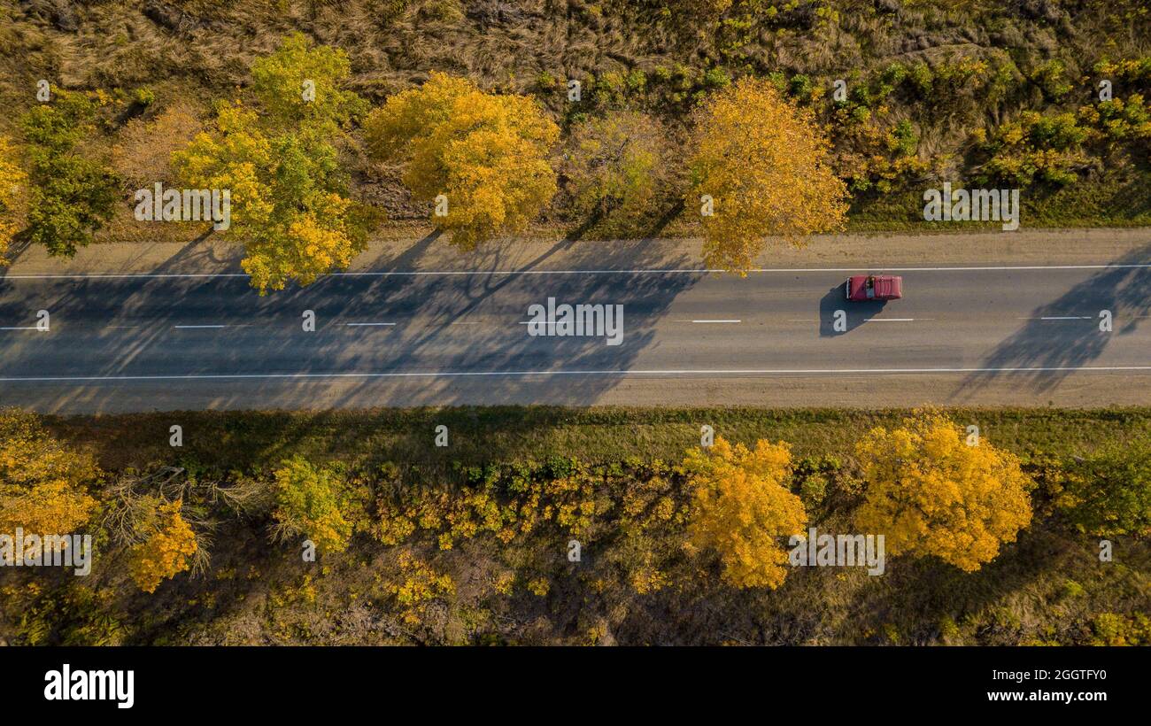 Overhead drone shot of freeway lane. with cars on the road, fly under ...