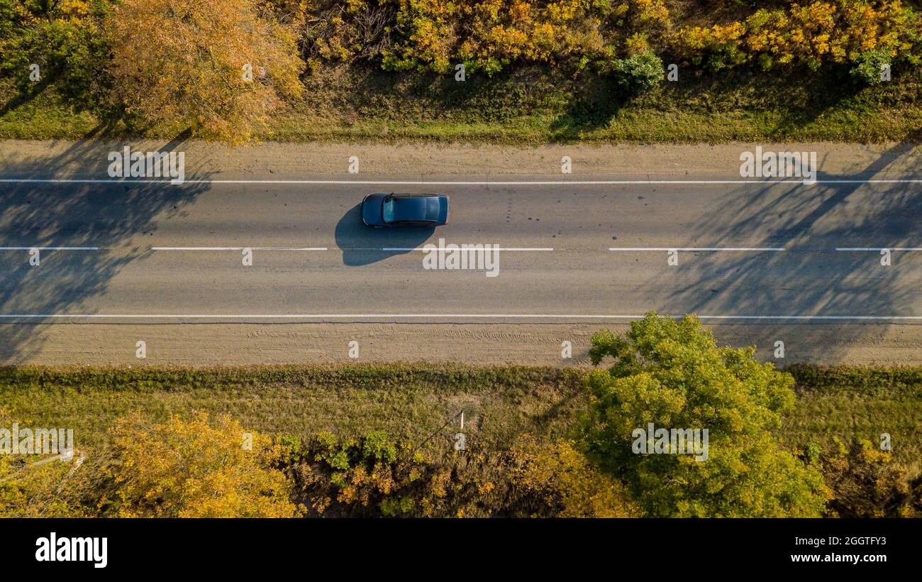 Overhead drone shot of freeway lane. with cars on the road, fly under ...