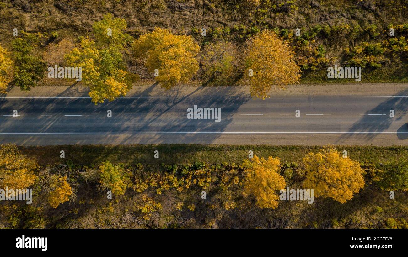 Overhead drone shot of freeway lane. with cars on the road, fly under ...