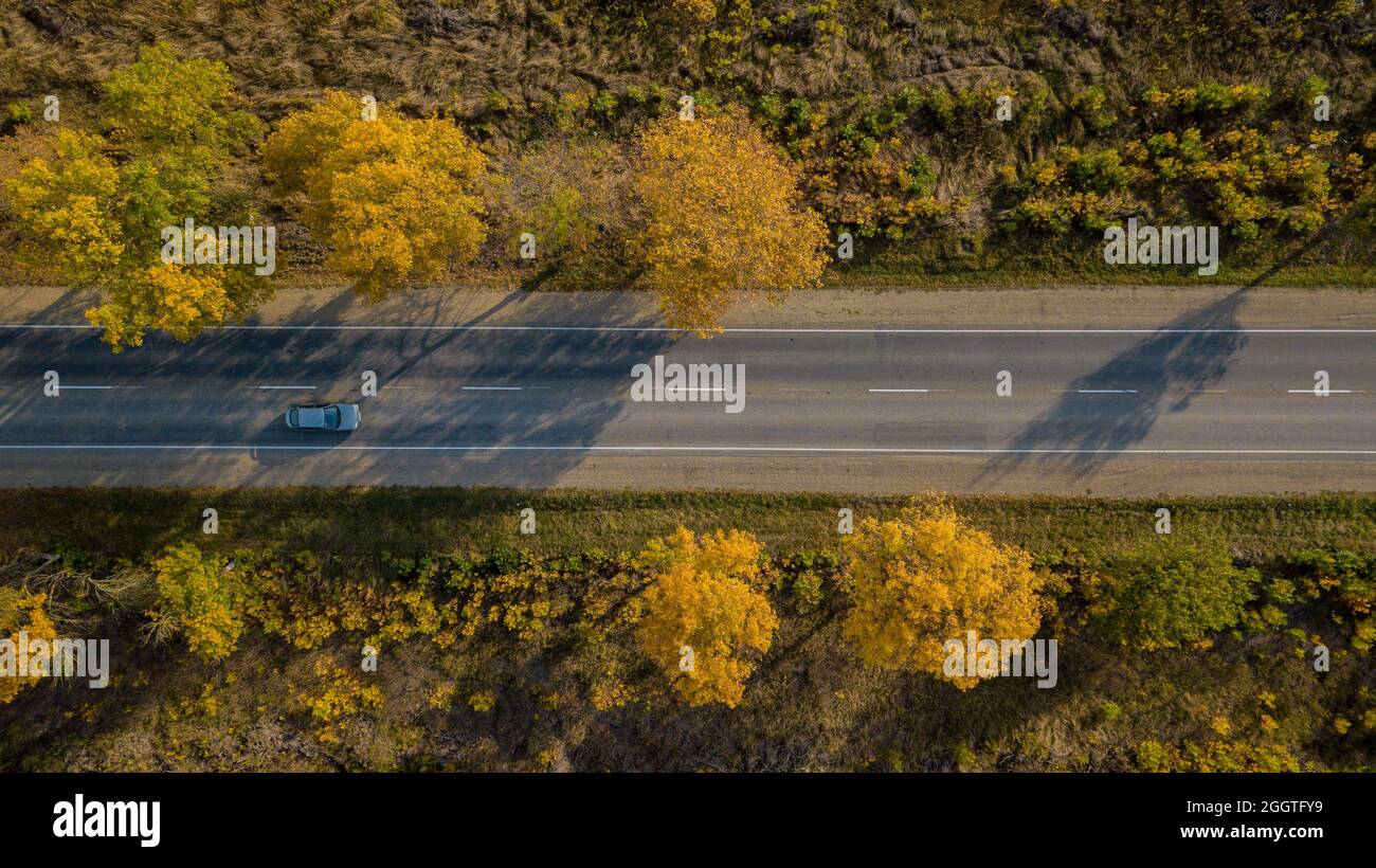 Overhead drone shot of freeway lane. with cars on the road, fly under ...