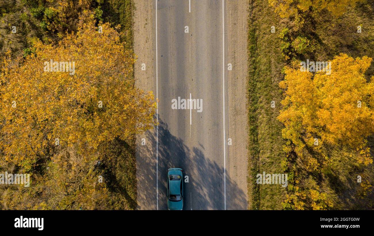 Overhead drone shot of freeway lane. with cars on the road, fly under ...