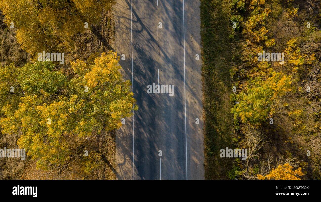 Overhead drone shot of freeway lane. with cars on the road, fly under ...