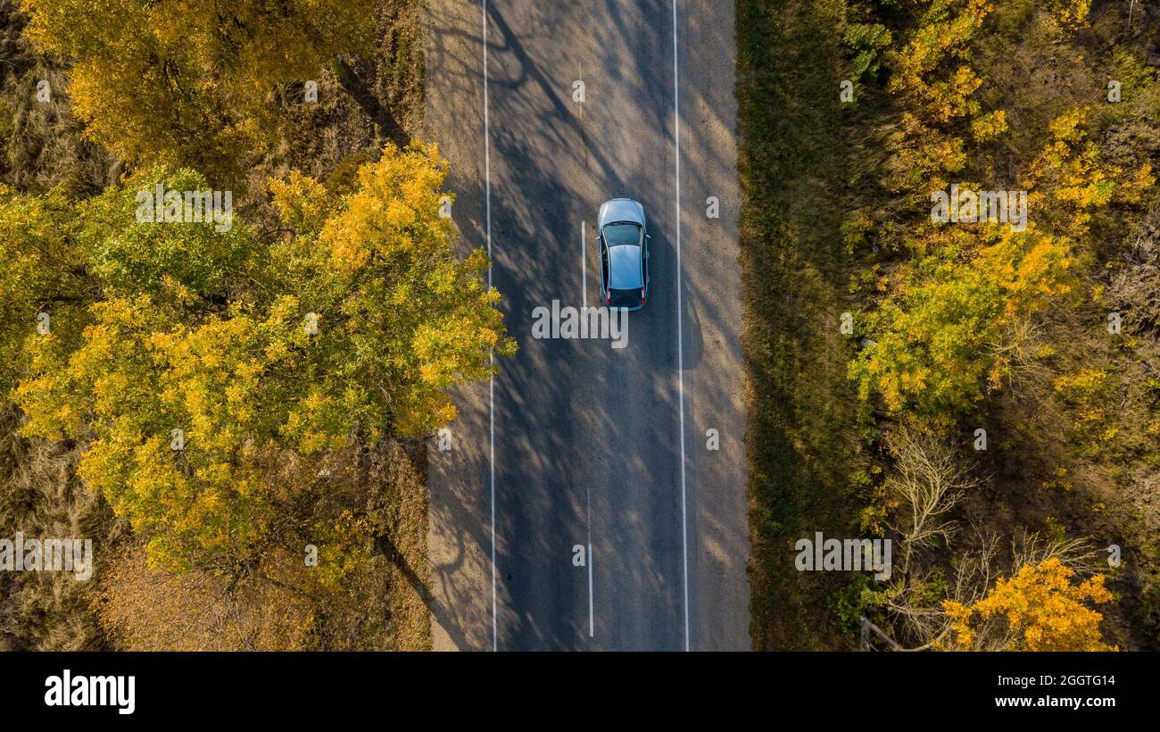 Overhead drone shot of freeway lane. with cars on the road, fly under ...