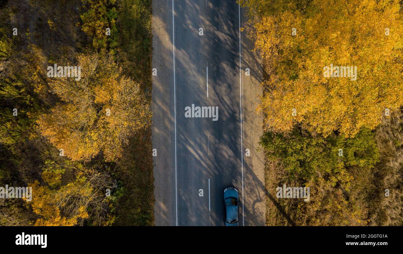 Overhead drone shot of freeway lane. with cars on the road, fly under ...