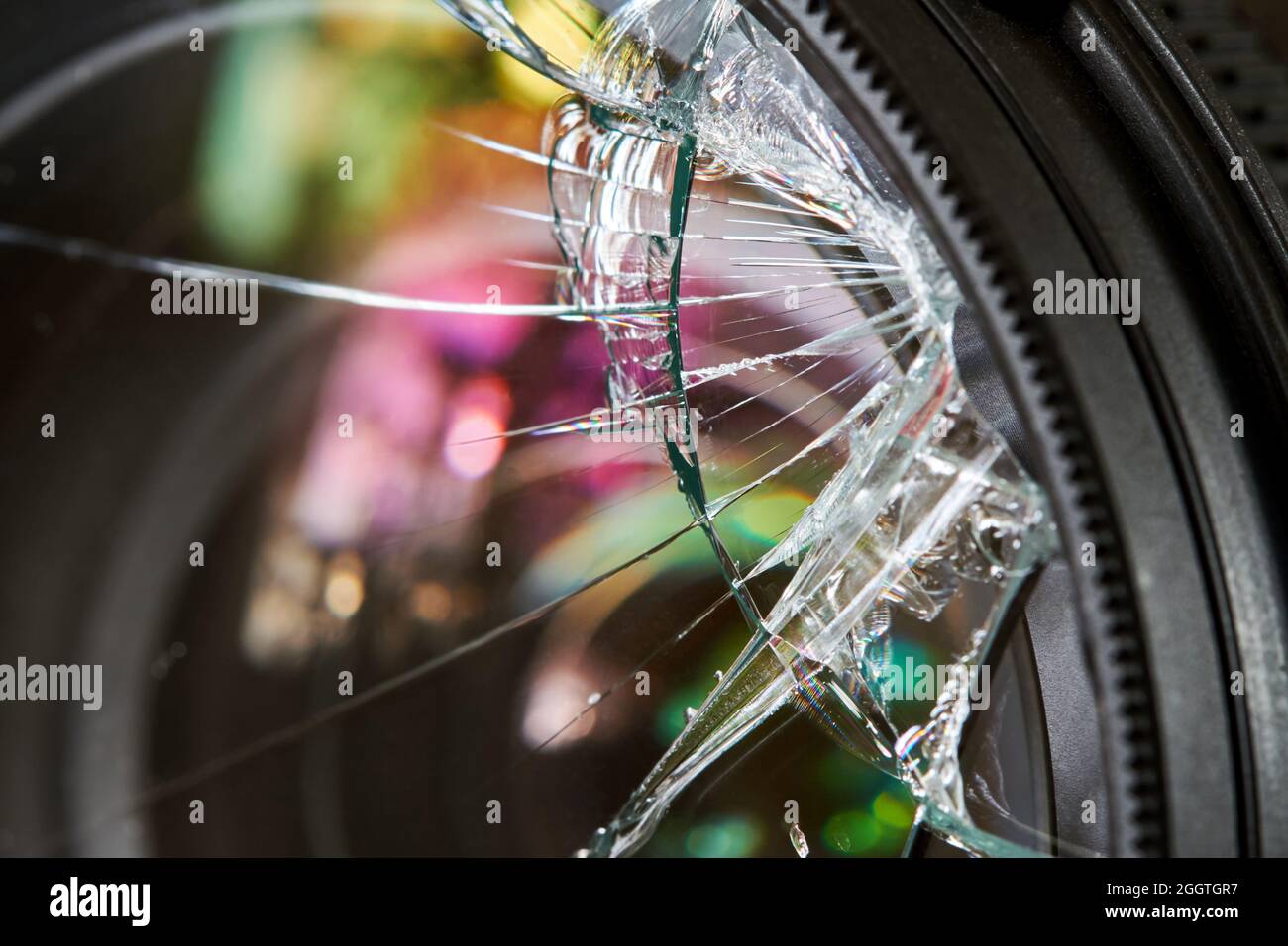 Broken lens filter on black photo camera. Closeup, selective focus ...