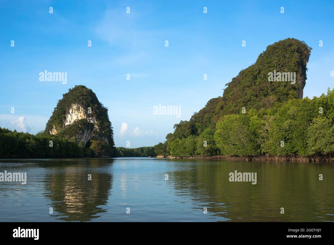 two high rocks are the main attraction of Krabi Thailand. river between ...