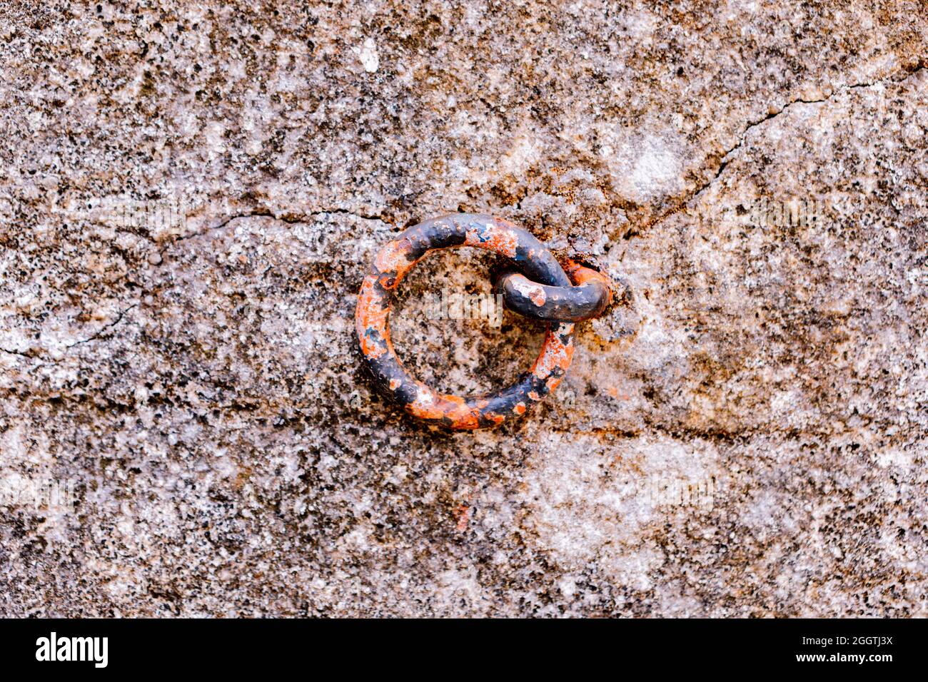 Rusty metal ring in a stone wall for tethering horses Stock Photo - Alamy